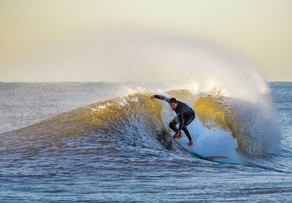 Serious Surfers Brave the Winter Chill to Ride Texas’ Waves